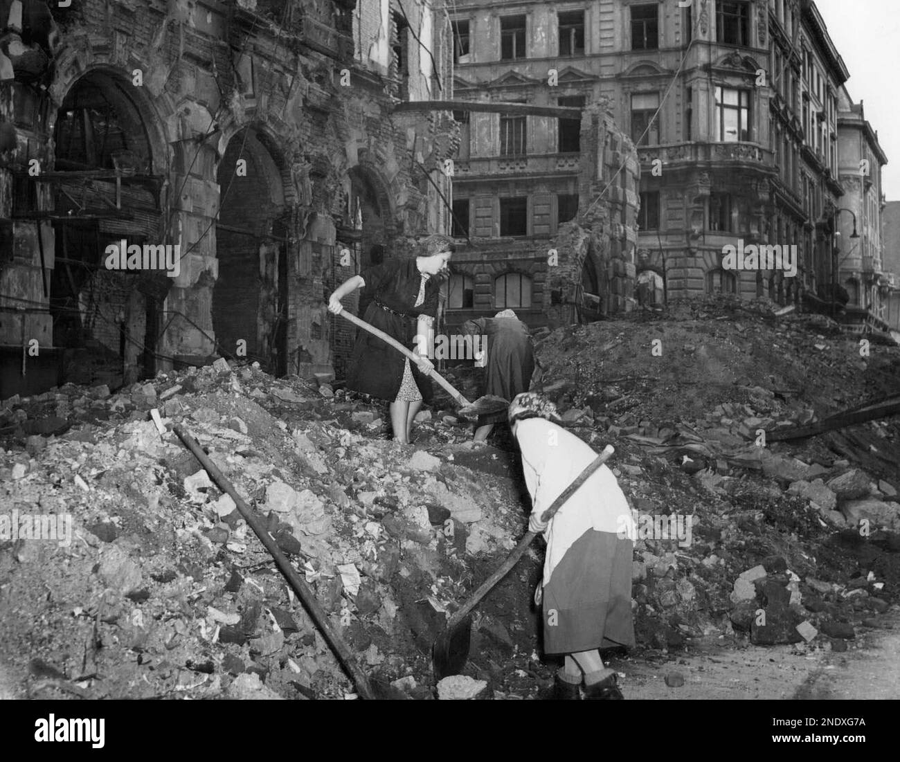 S.S. women at work in the streets of Vienna, cleaning away rubble ...
