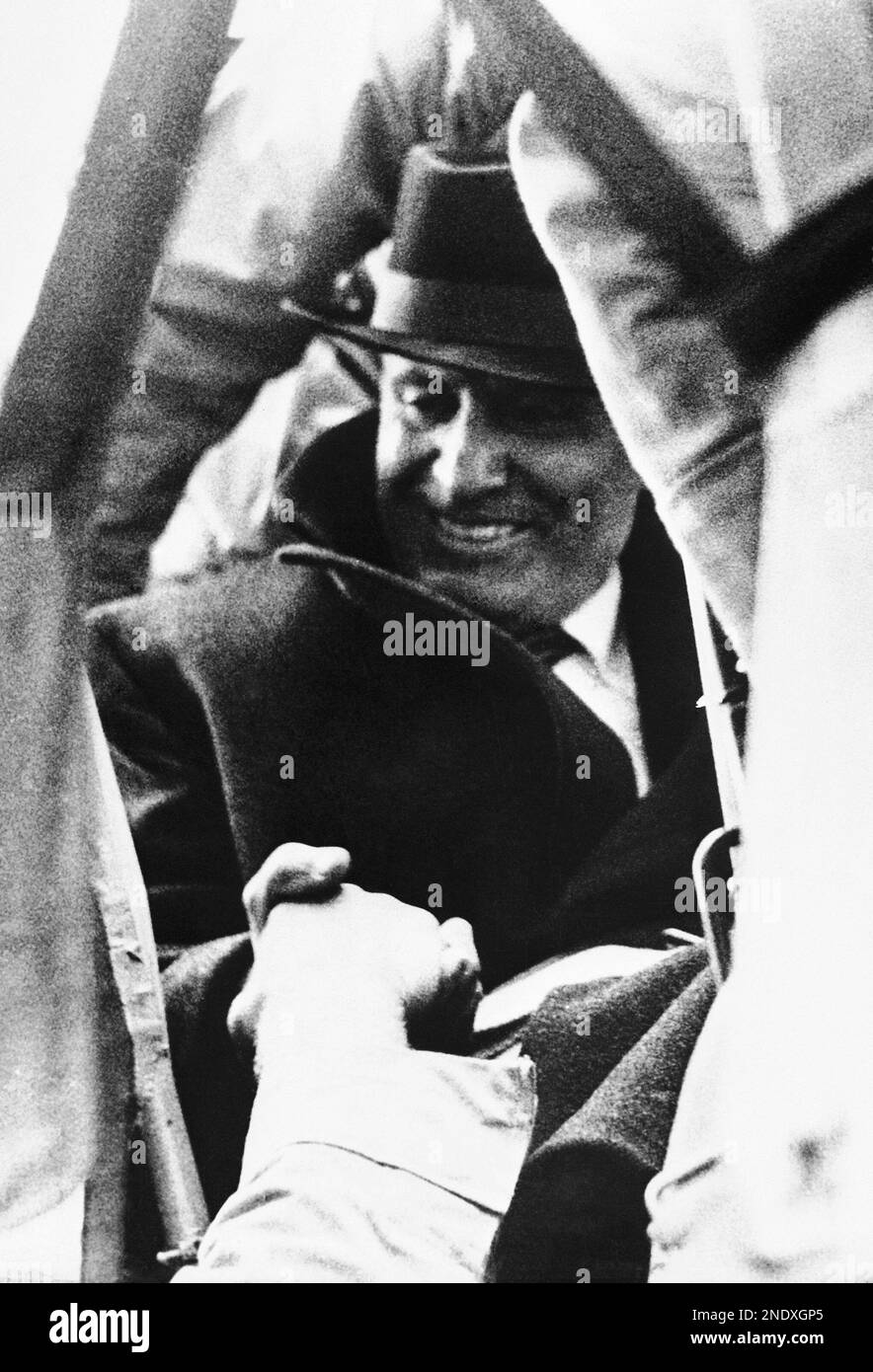 Italian dictator Benito Mussolini, seated in the rescue plane, bids ...