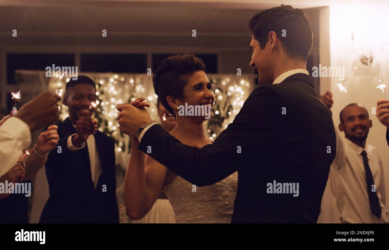I wanna have this dance. an affectionate young newlywed couple dancing ...