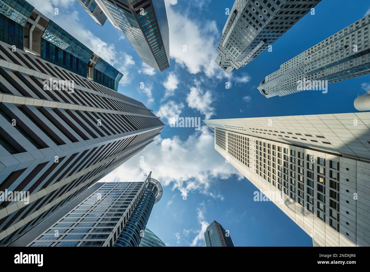 Singapore, city skyline looking up under skyscraper building business ...
