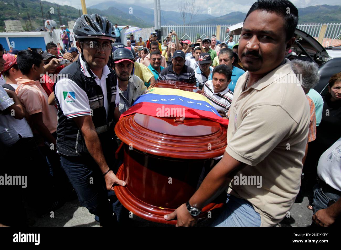 People carry the coffin containing the remains of former boxing ...