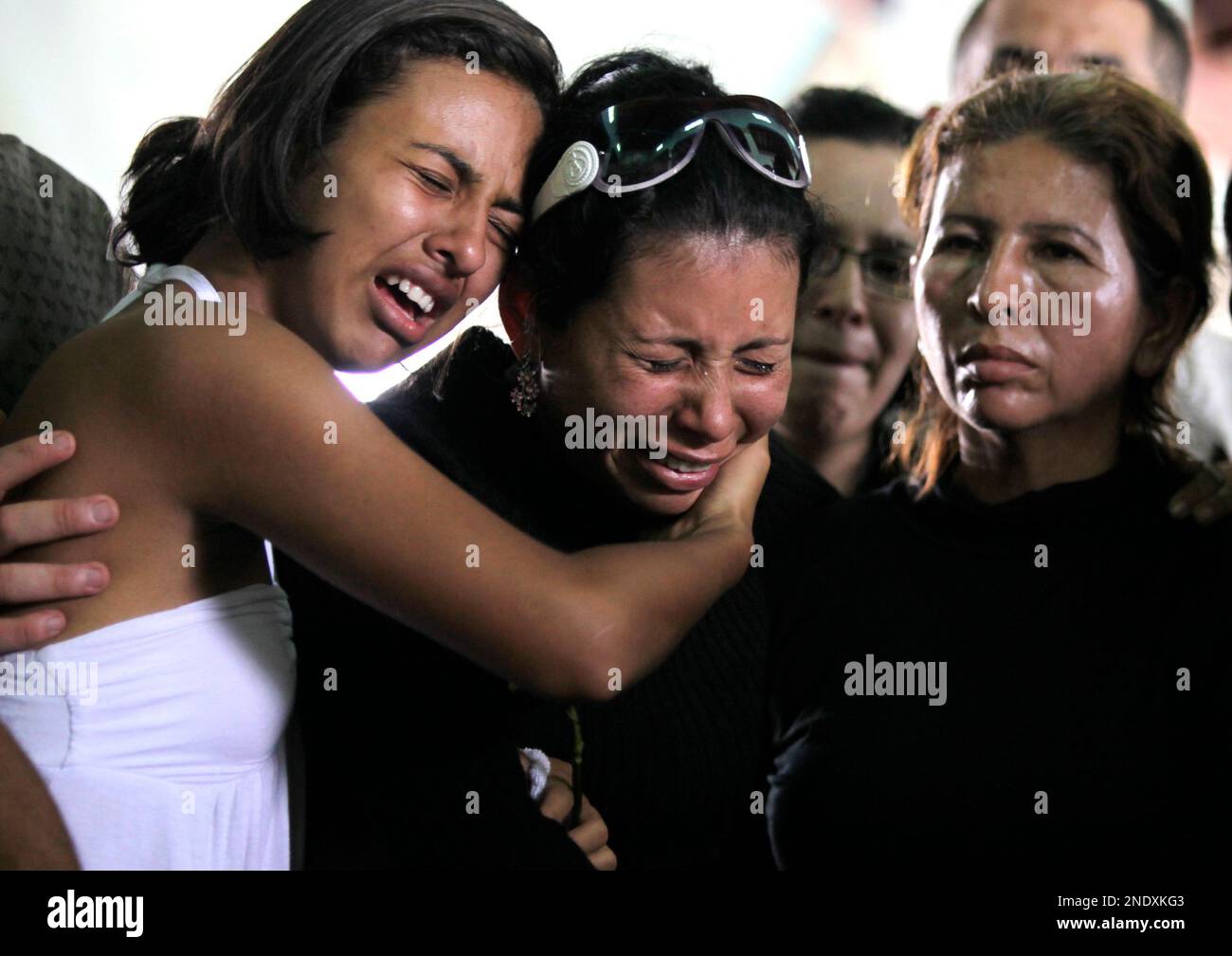 Relatives of former world boxing champion Edwin Valero react during his ...