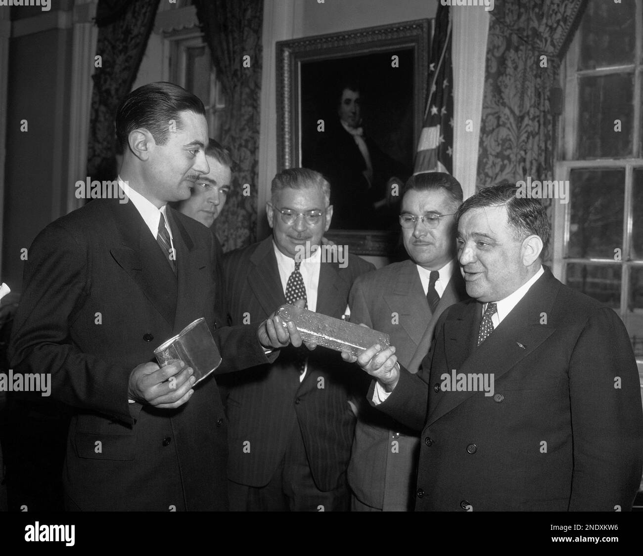 Herman Lass, left, head of a Brooklyn Refining Co., hands Mayor Fiorino ...