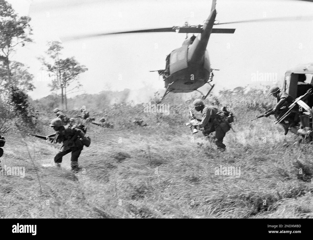 U.S. infantrymen storm from helicopter rushing for cover on Oct. 11 ...