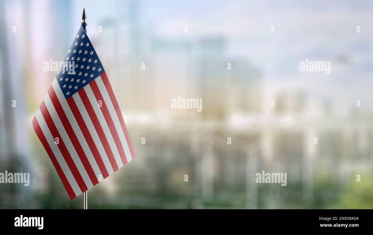 Small flags of the USA on an abstract blurry background Stock Photo - Alamy