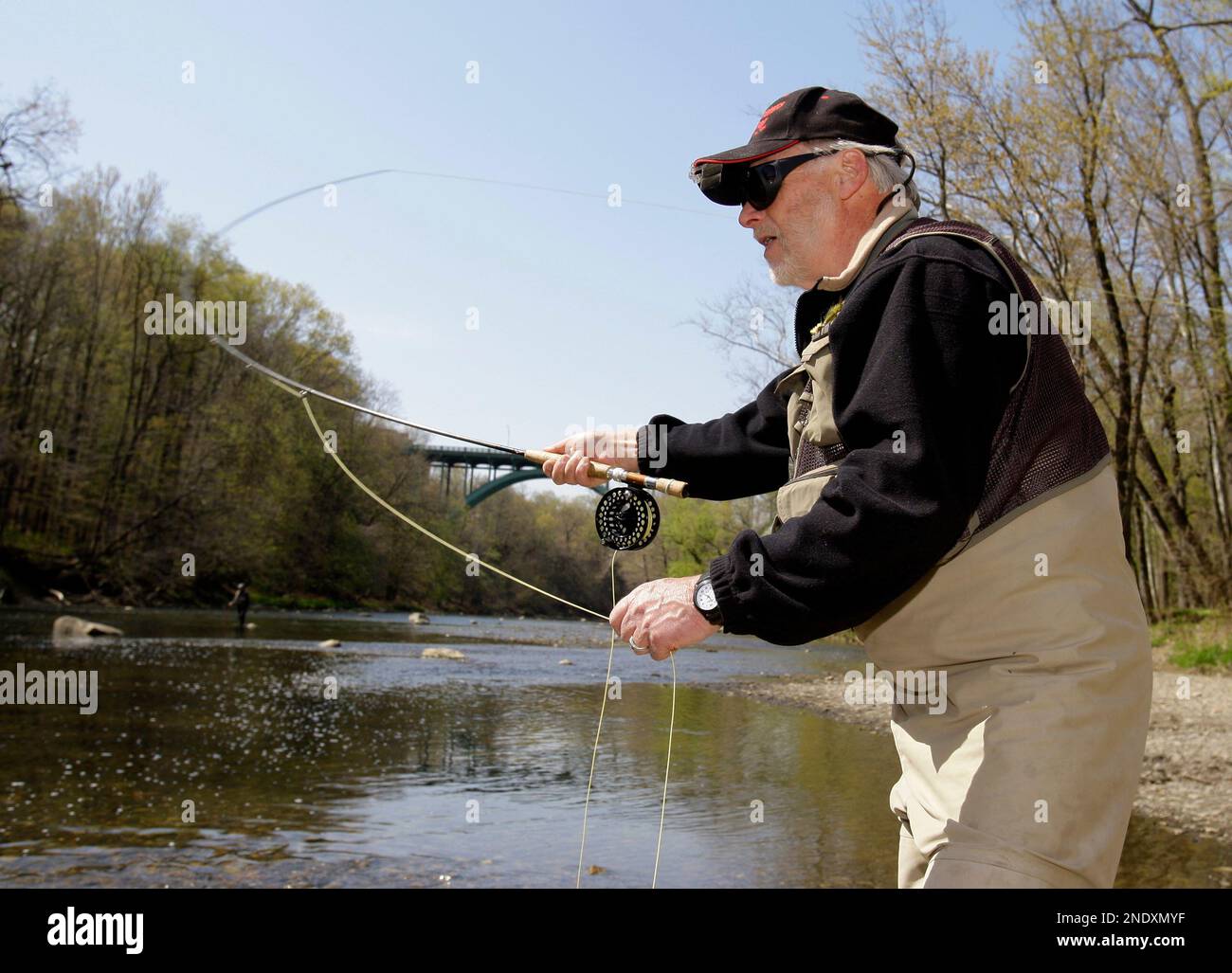 Eddie Fryberger, from Akron, Ohio, fishes the Rocky River for steelhead ...