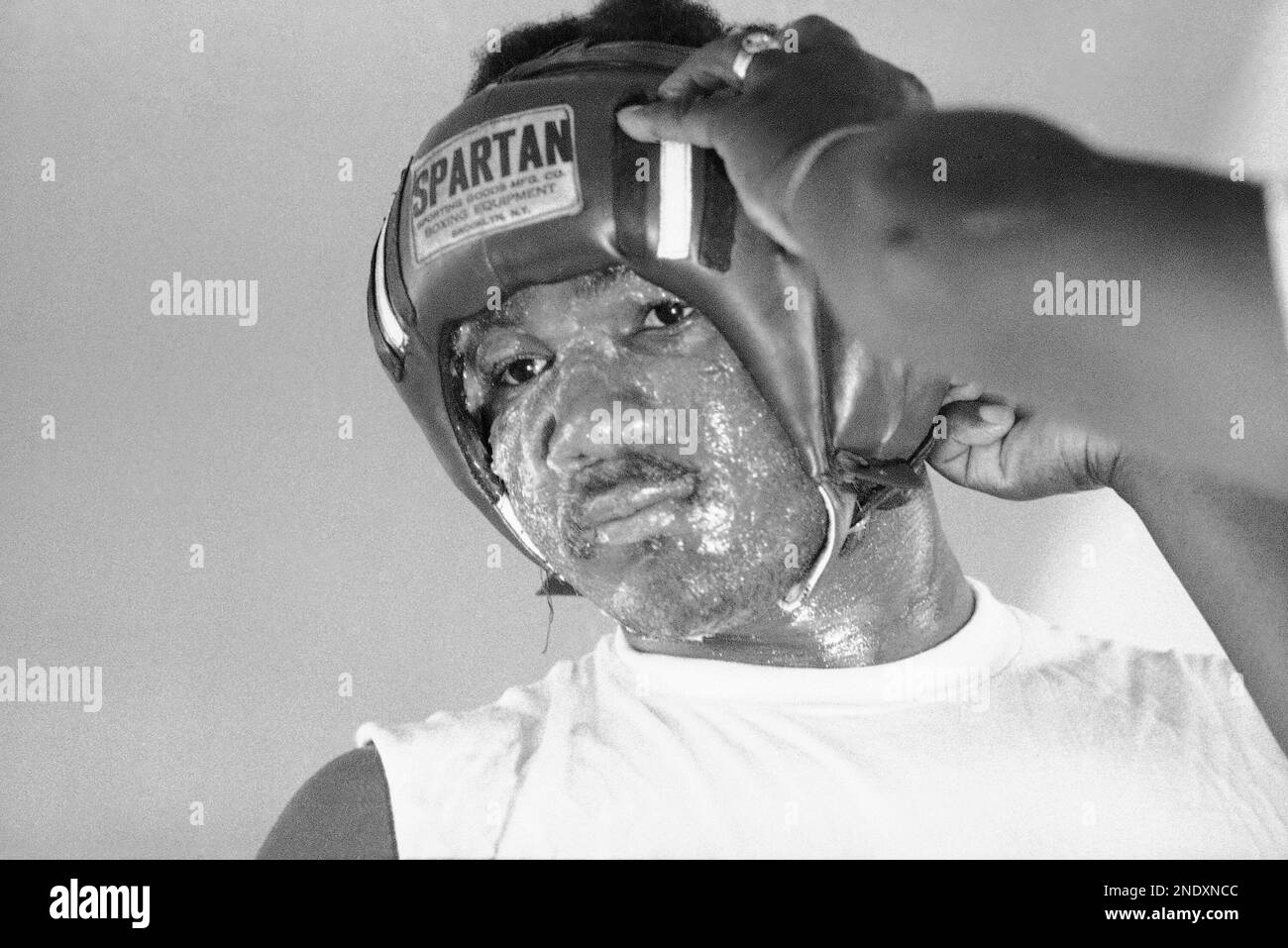 World Heavyweight champion George Foreman between training rounds with ...