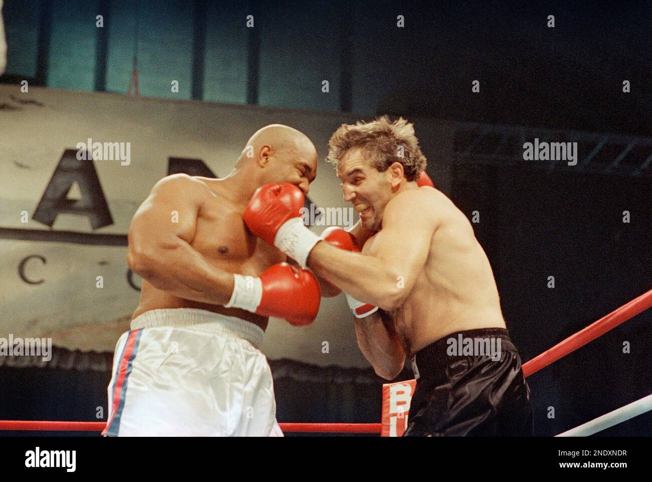 Heavyweight fighters George Foreman and Gerry Cooney are in round one ...