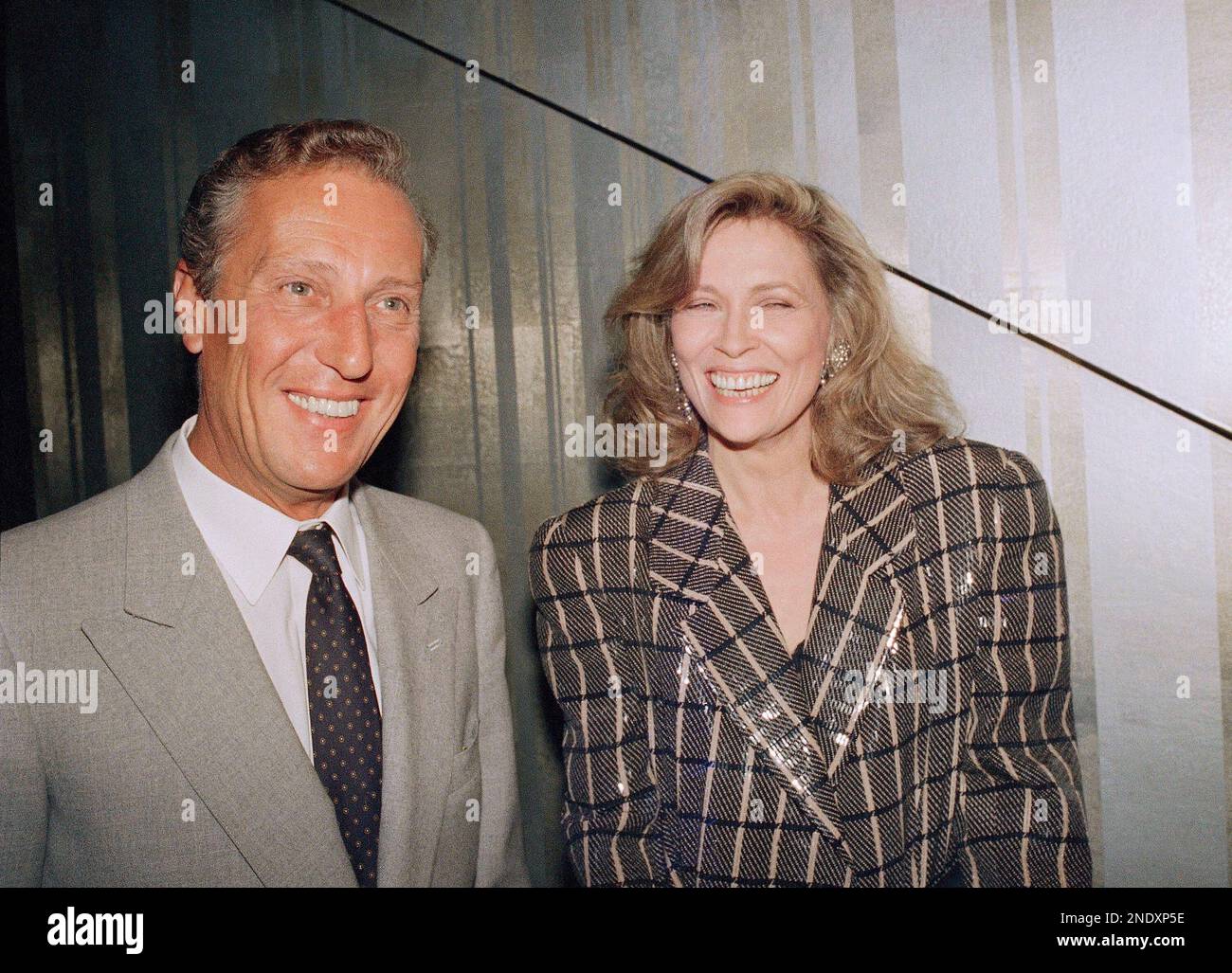 Actress Faye Dunaway is shown with an unidentified escort on her way in ...