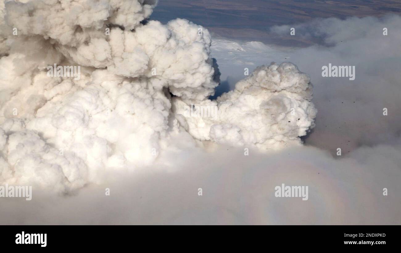 This aerial photo shows a plume of ash rising from the volcano in ...