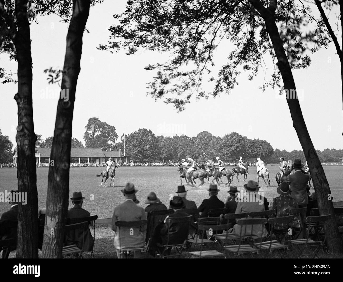 Spectators watch the Junior Championship Polo final at Roehampton ...
