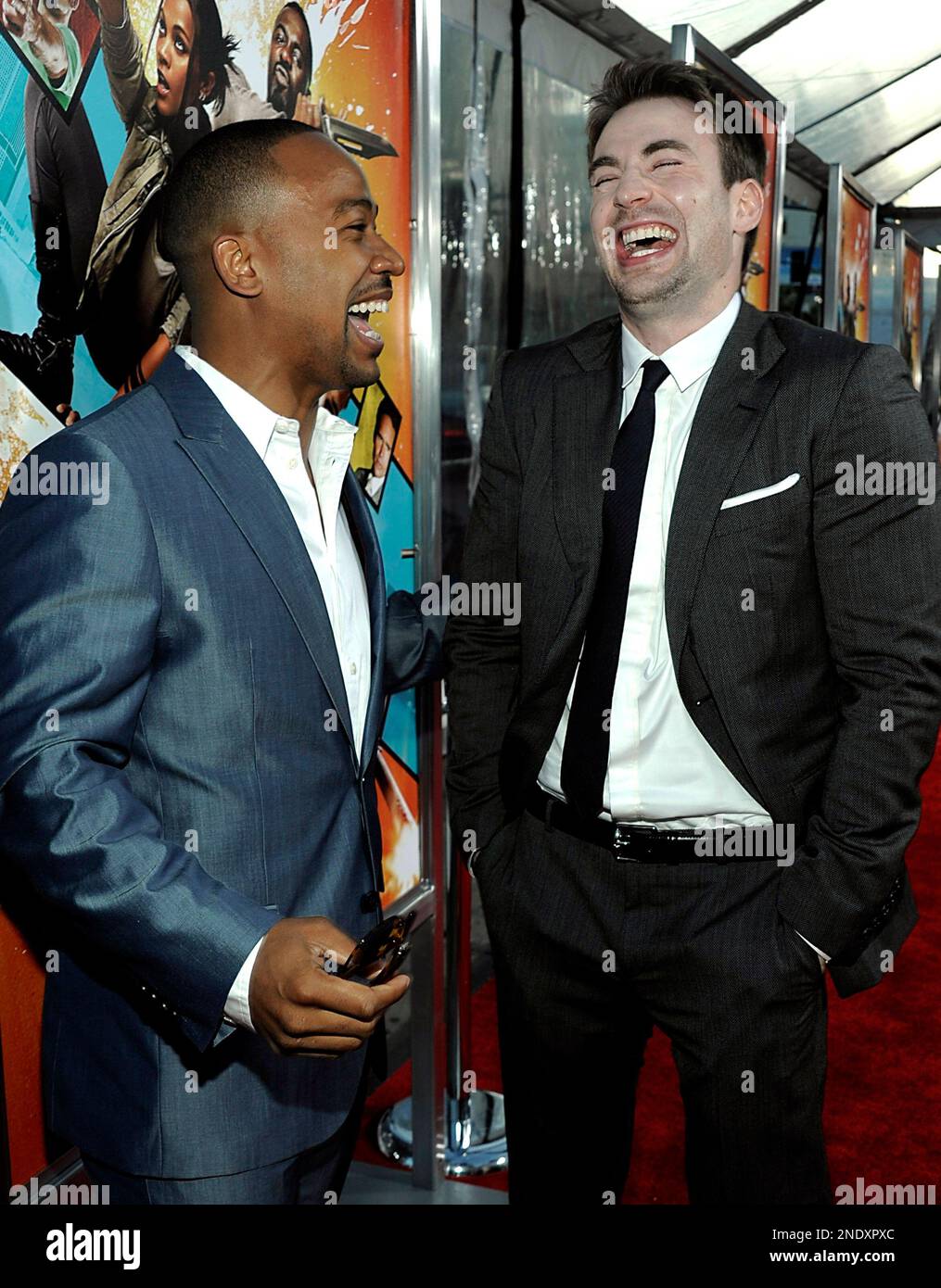 Actor Chris Evan, right, and actor Columbus Short arrive at the premier ...