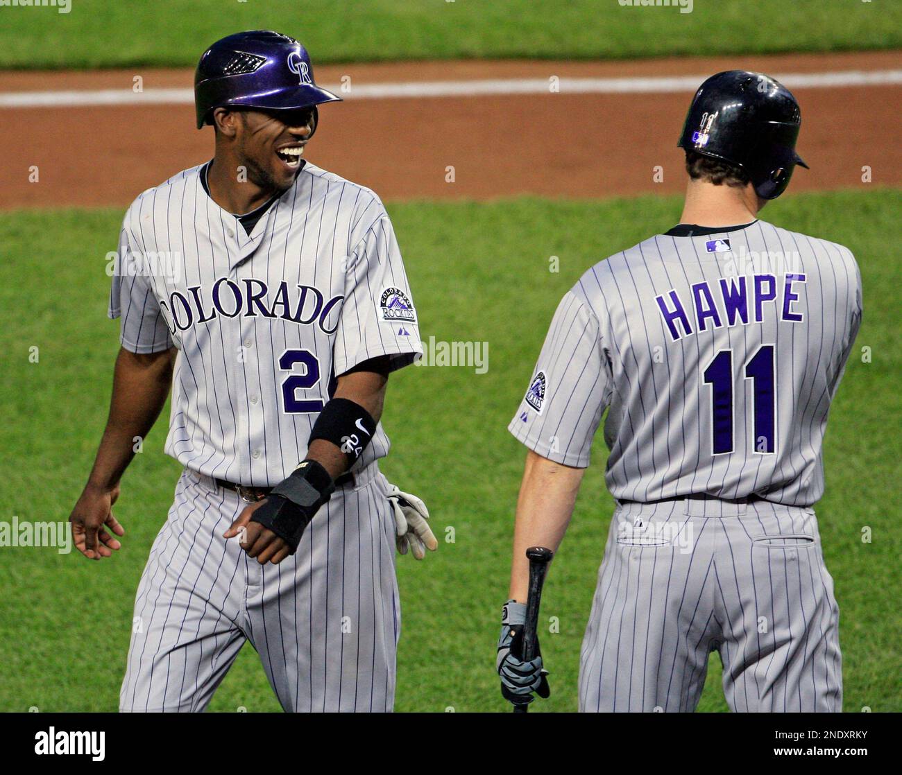 Colorado Rockies' Dexter Fowler, left, laughs with teammate Brad Hawpe ...