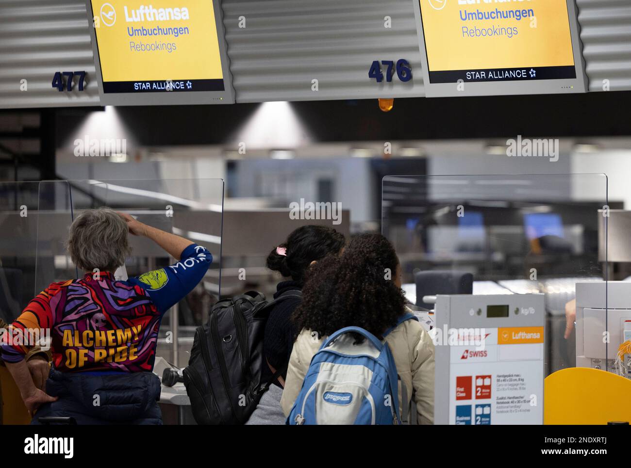16 February 2023, Hesse, Frankfurt/Main: Passengers stand in front of a ...