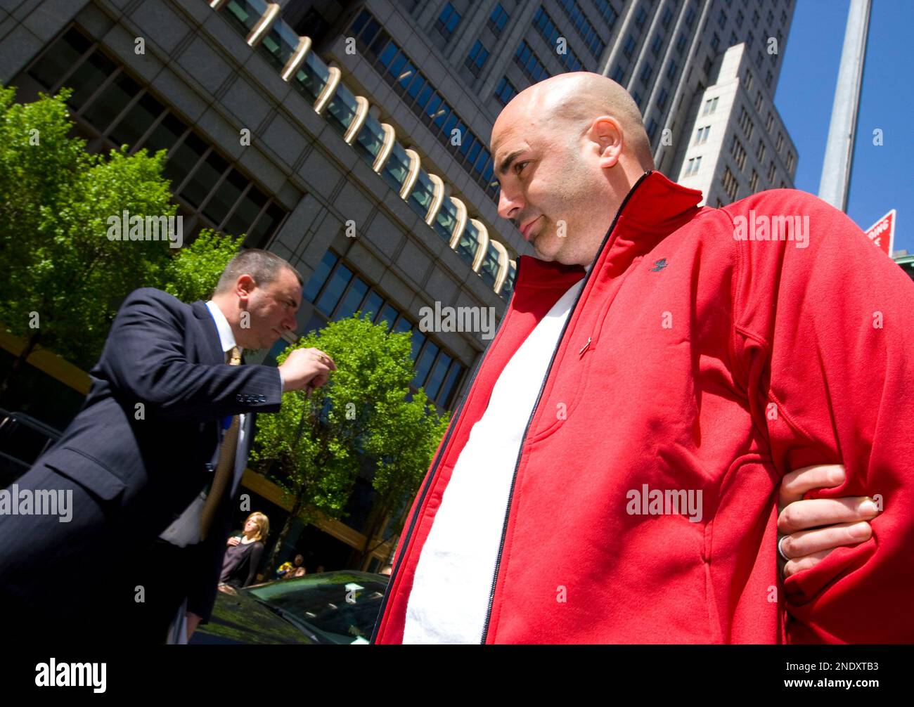 Federal agents escort Thomas Scarpaci, a reputed member of the Gambino ...