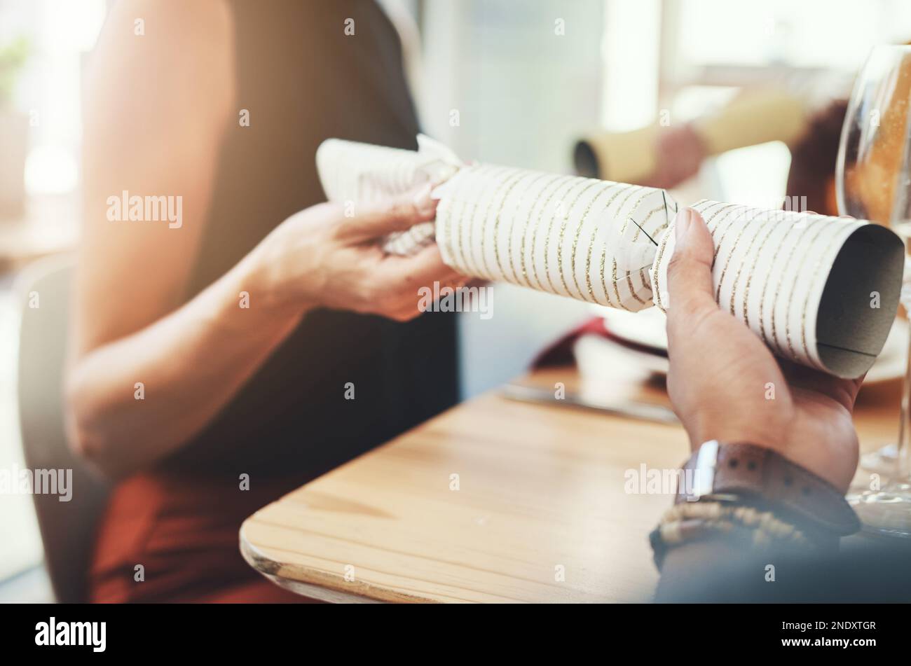 Its time for a surprise. unrecognizable people pulling crackers while ...
