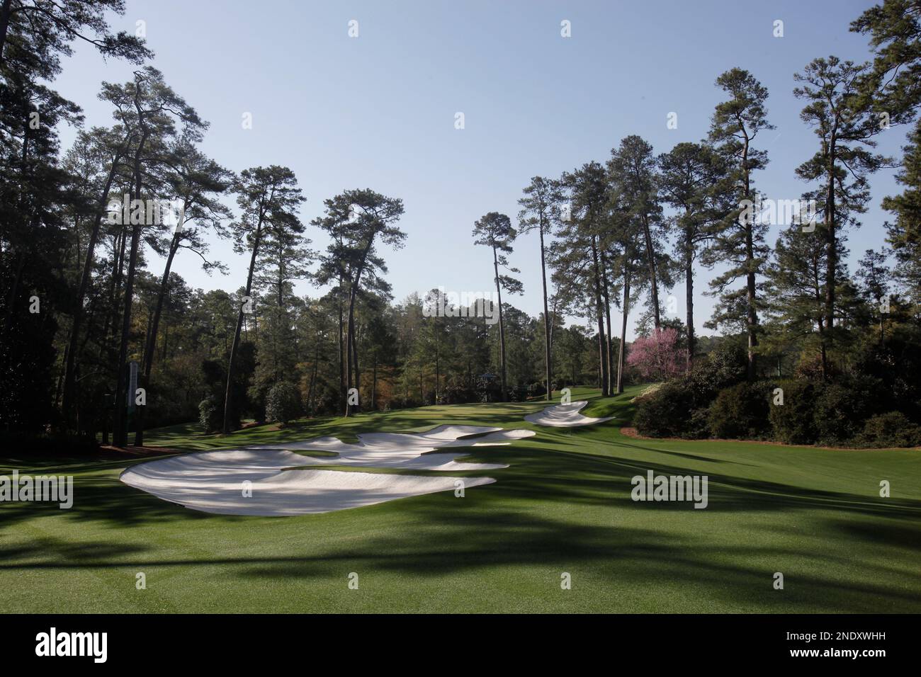 Bunkers line the green on the 10th hole at Augusta National Golf Club ...