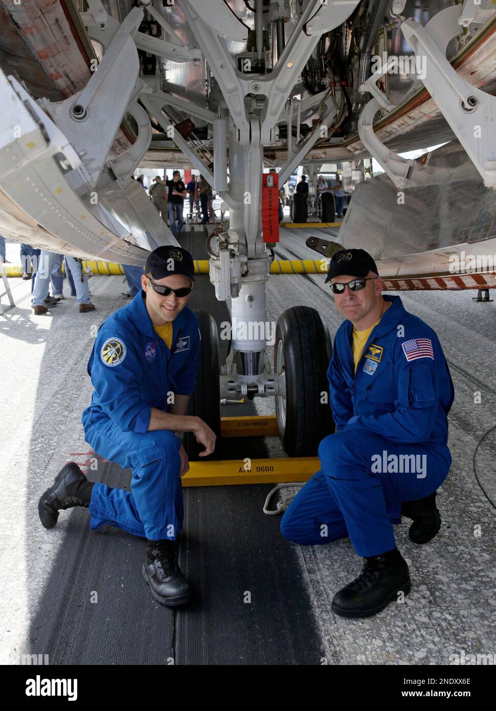 Space shuttle Discovery pilot James Dutton, left, and commander Alan ...