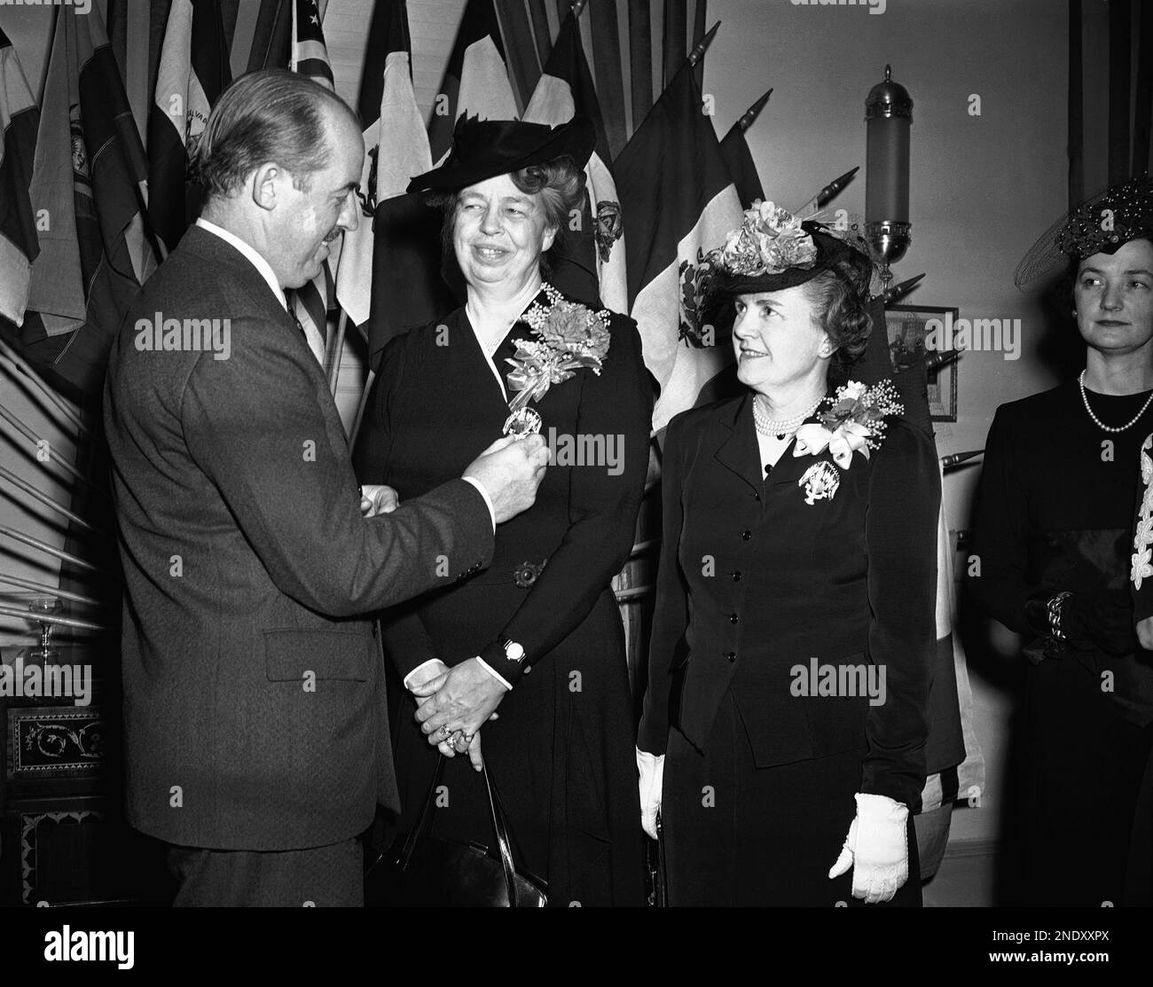 Bruce Gould, magazine editor, presents to first lady Eleanor Roosevelt ...