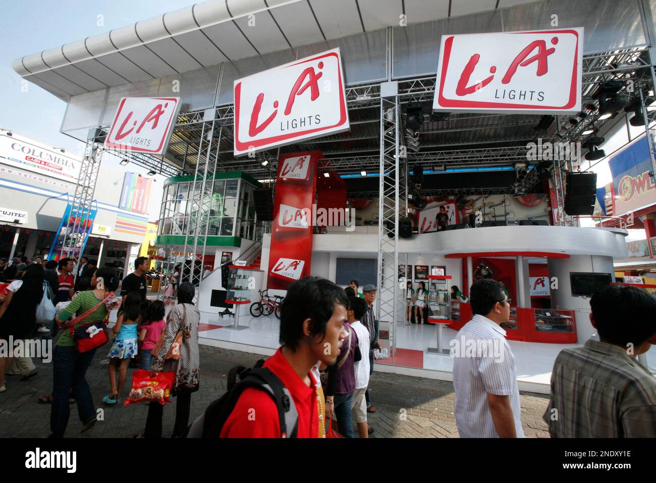 In this photo taken on June 28, 2009, visitors walk past a cigarette ...
