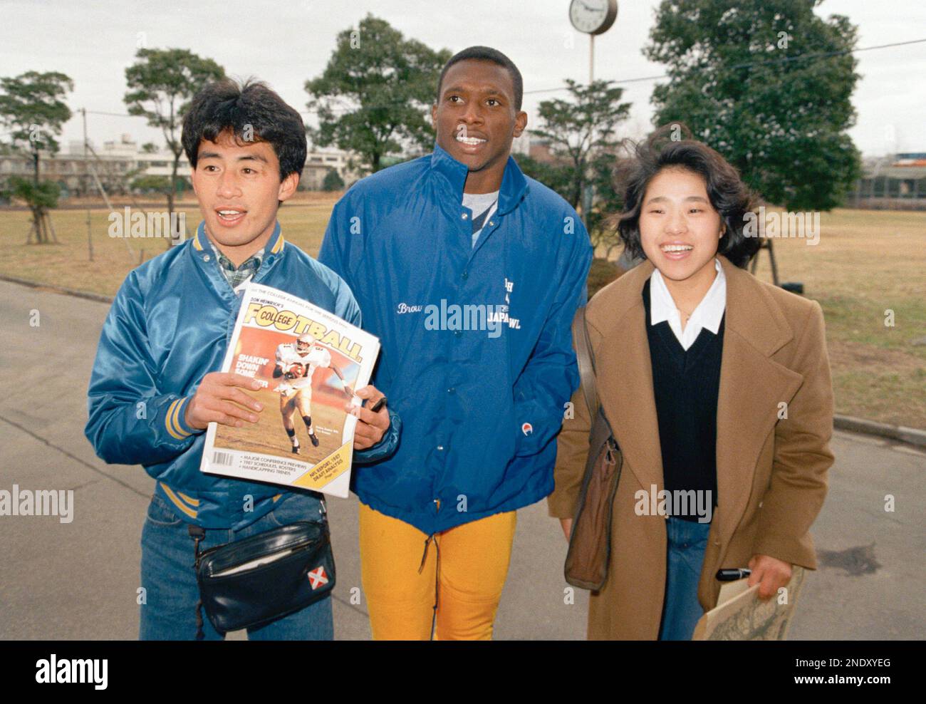 Heisman trophy winner Tim Brown of Notre Dame is flanked by Japanese ...