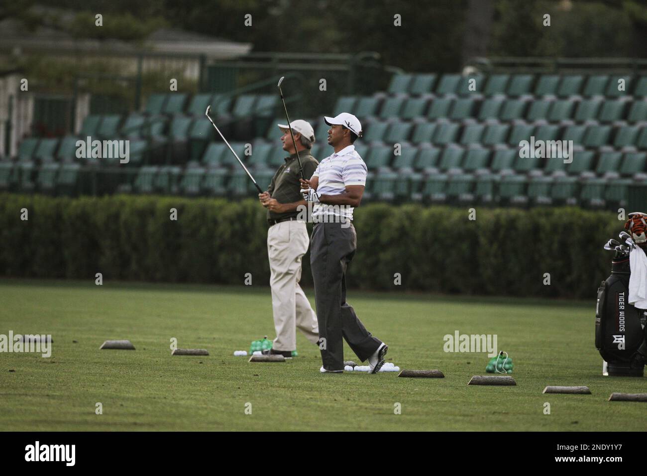 Tiger Woods, right, and Fred Couples on the driving range before ...