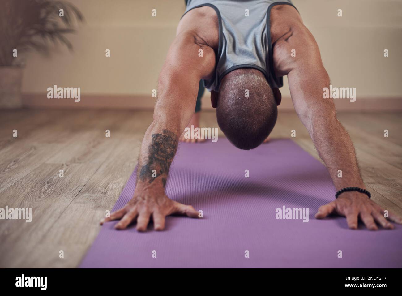Stretching the shoulders. an unrecognizable man holding a downward ...