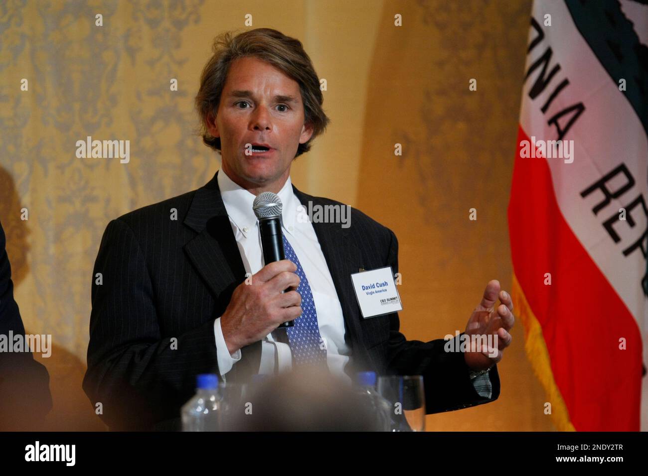 Virgin America CEO David Cush gestures during a meeting of the 7th ...