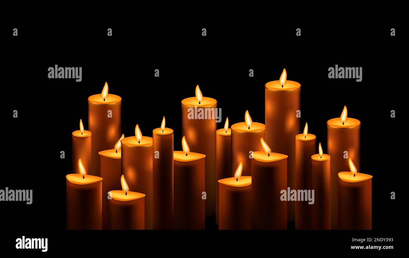 Large set of burning wax candles in center on black background with ...