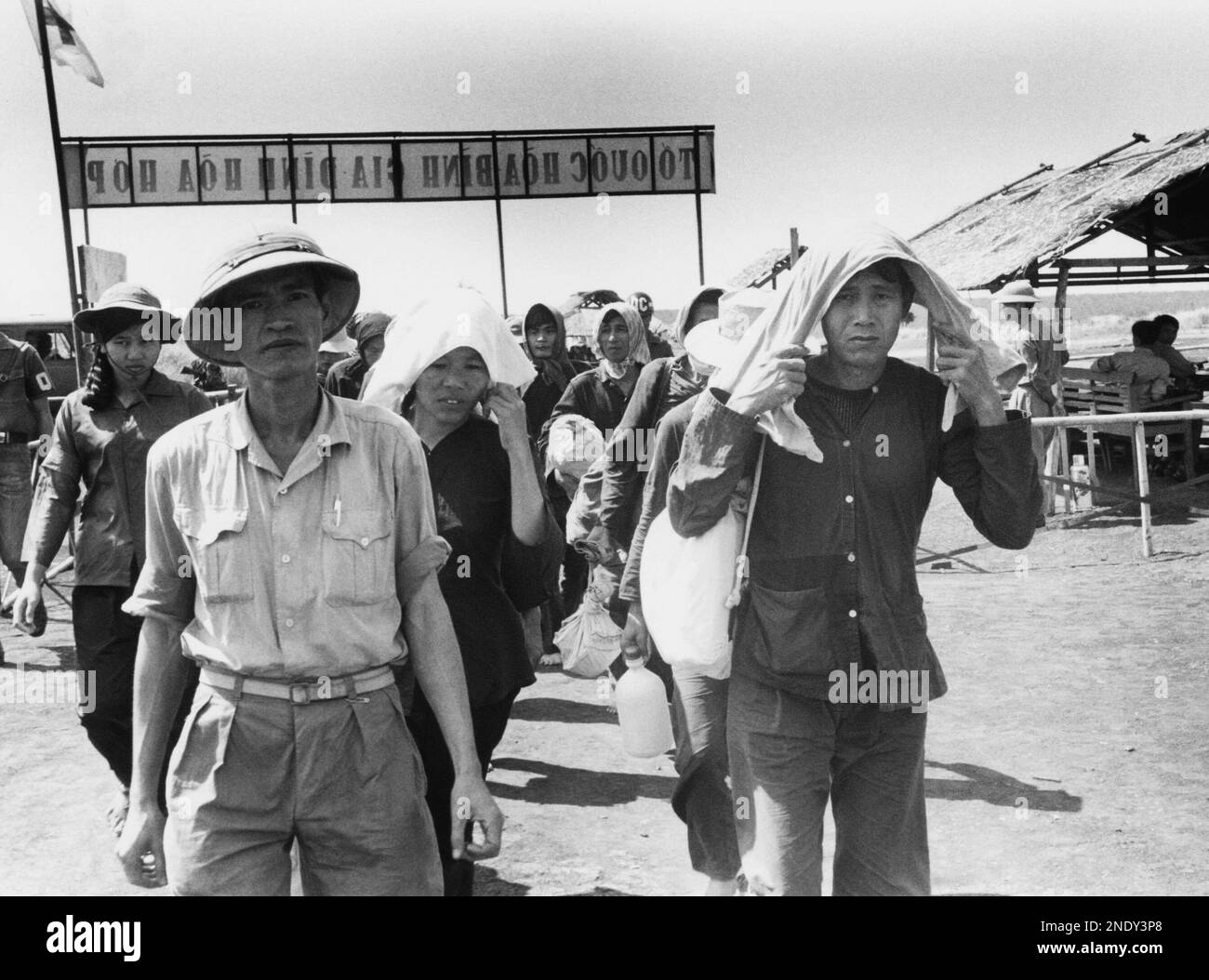 A group of Viet Cong prisoners are led to a Viet Cong camp in Loc Ninh ...