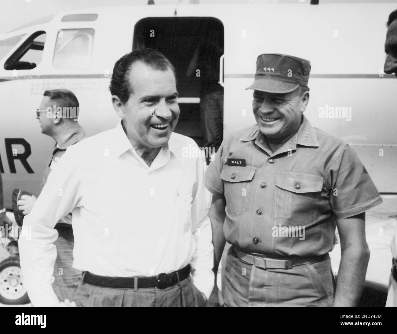 Vice President Richard Nixon chats with Lt. Gen. Lewis W. Walt during a ...