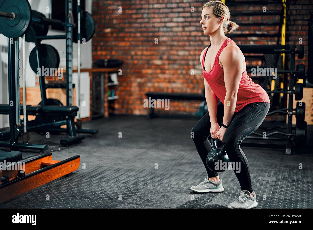 Dedicated and disciplined. Full length shot of an attractive young female athlete working out ...