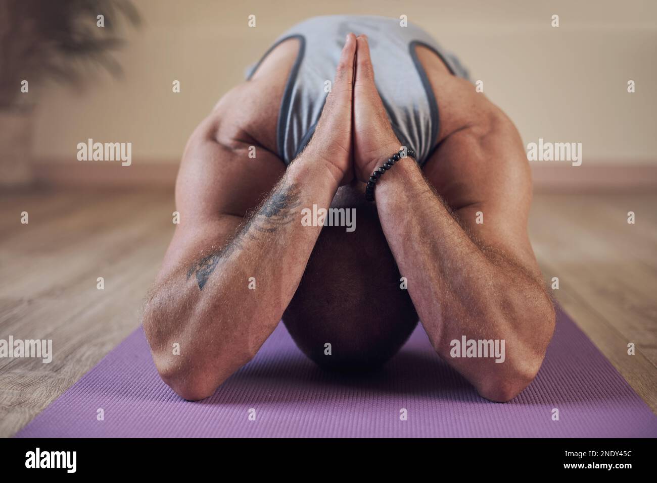 Yoga is a practice that runs deep in the muscles. an unrecognizable man ...