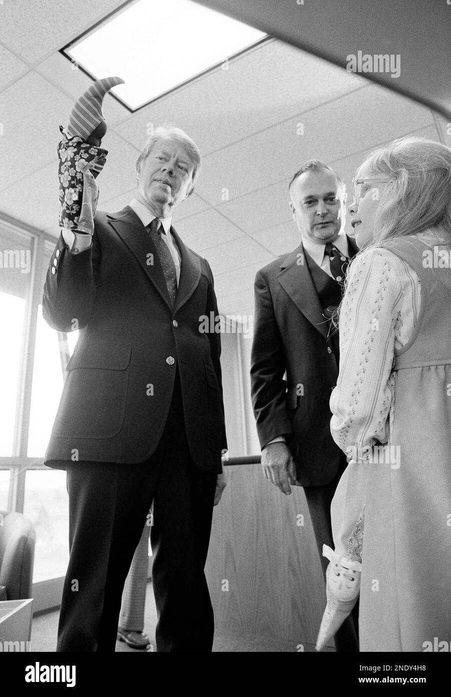 President Jimmy Carter shows his daughter Amy a puppet as they tour the ...