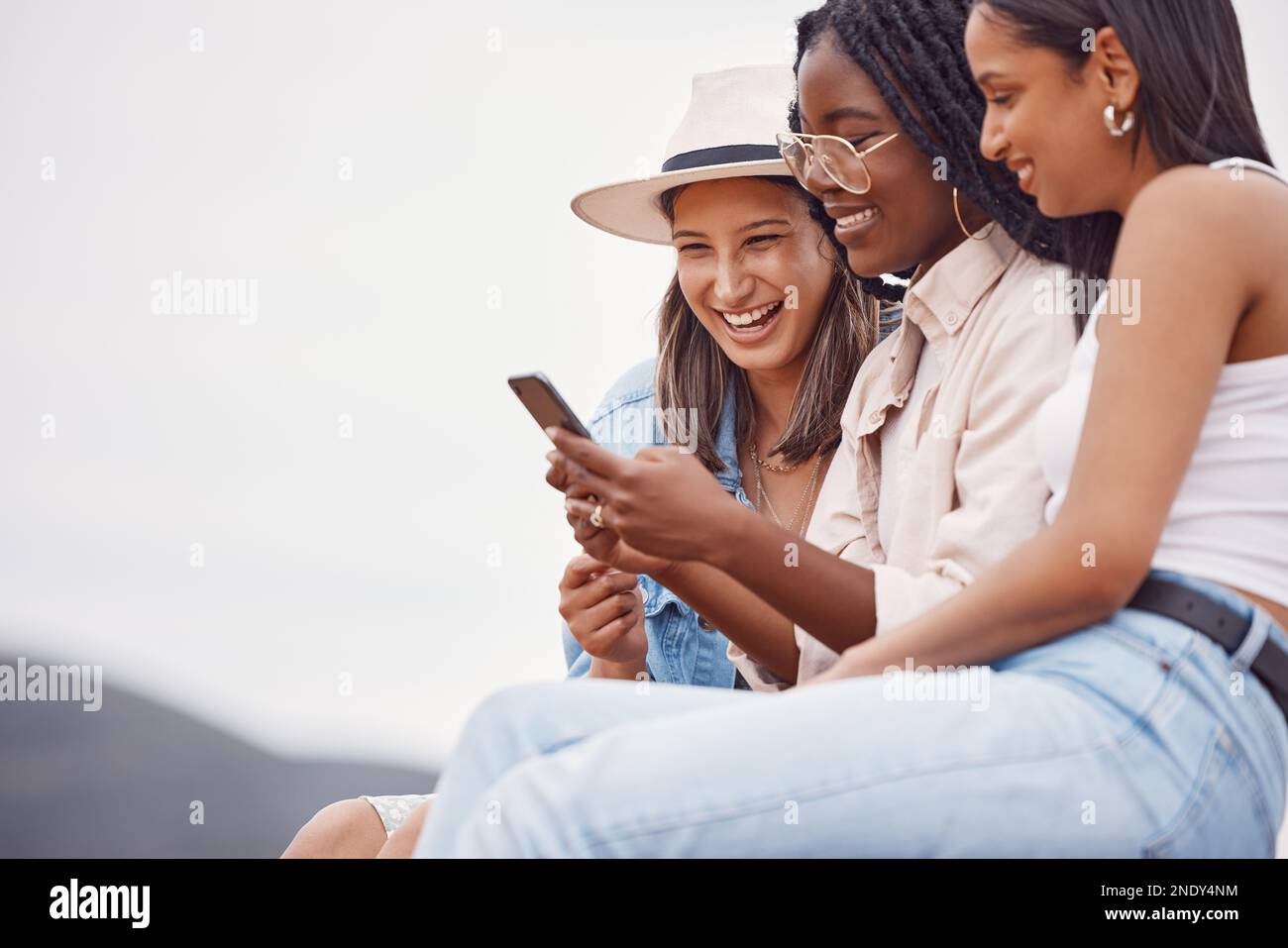 Social media, laughing and women with a phone meme, funny website and ...