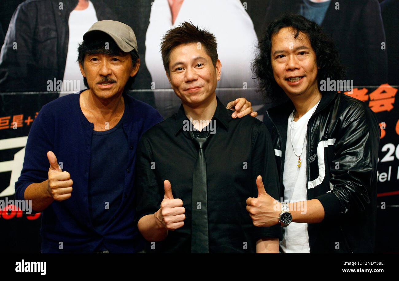 Hong Kong veteran Cantopop singer George Lam, left, poses with Tai Chi ...