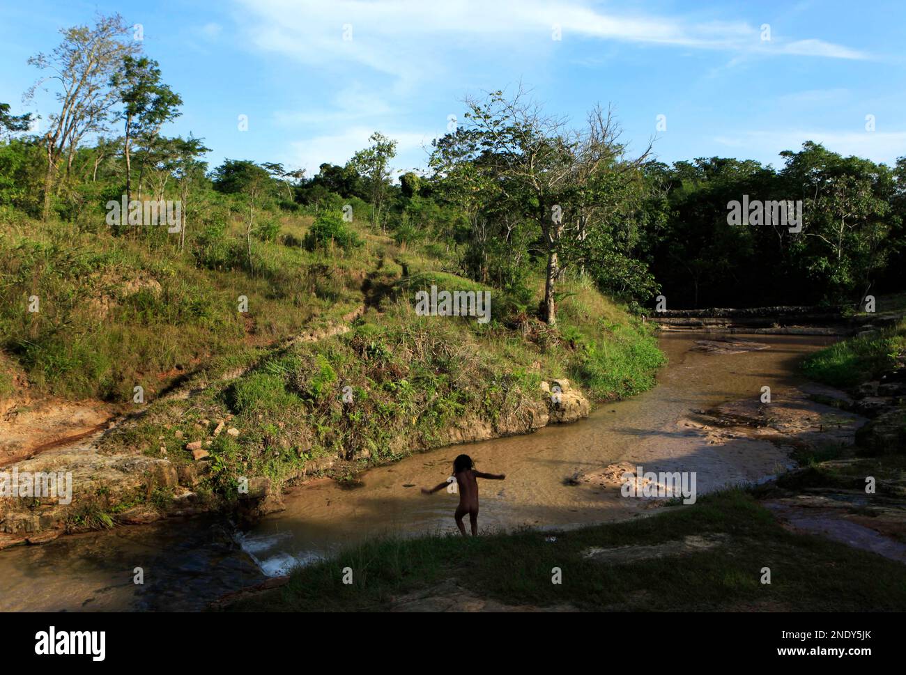 Daniela Payvagi, a child from the Ache indigenous group, plays near a ...