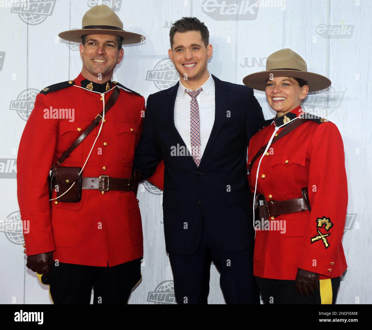 Singer Michael Buble poses with some Mounties as he arrives at the Juno ...