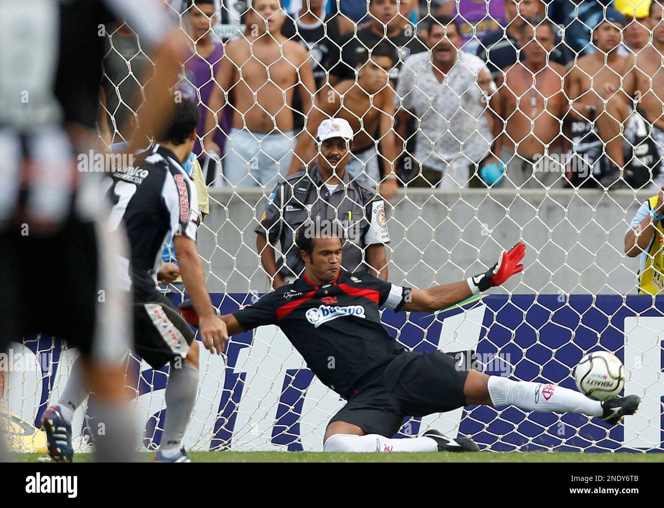 Botafogo's German Herrera, second from left, takes a penalty kick to ...