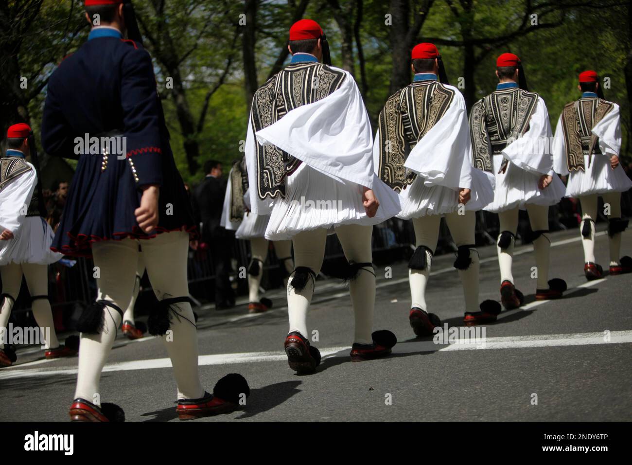 Members of the Greek National Guard, known as the Evzones, march at the ...