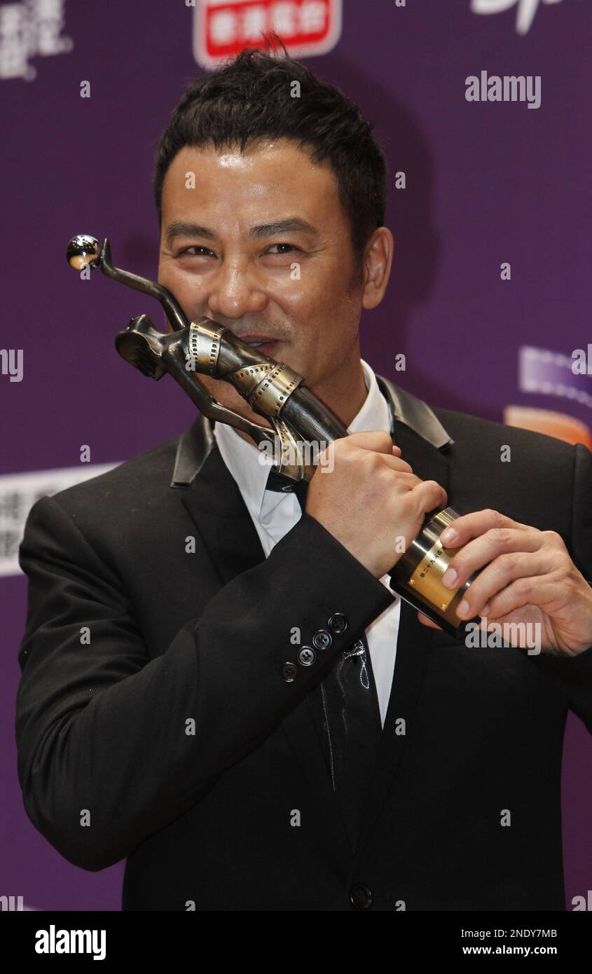 Hong Kong actor Simon Yam celebrates after winning best actor for his ...