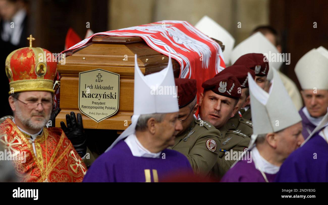 Soldiers carry coffin of Late Polish President Lech Kaczynski out of th ...