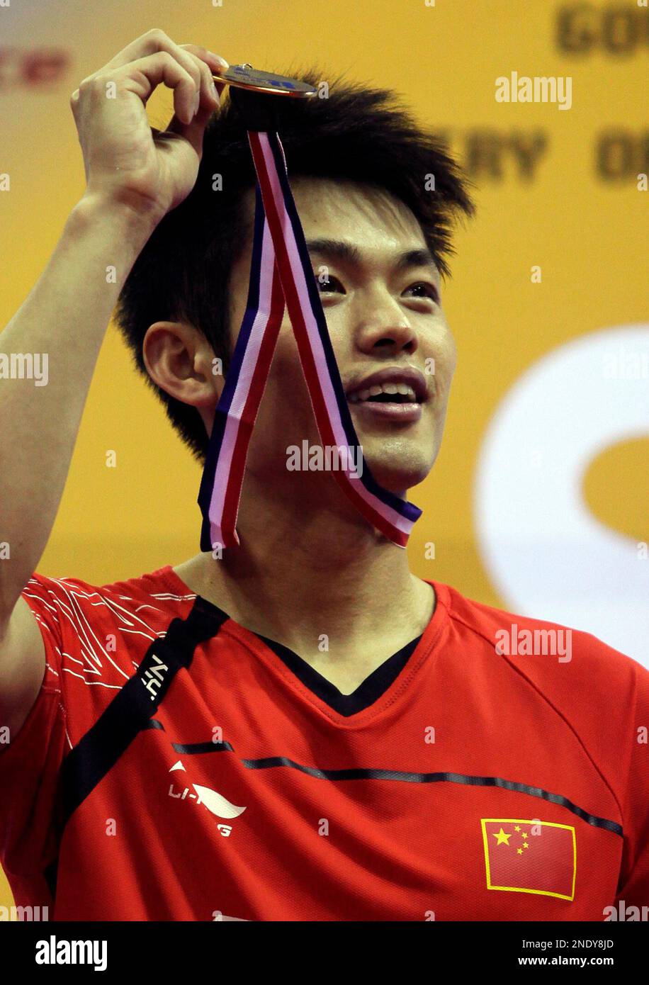 China's Lin Dan poses at the medals presentation ceremony after he ...