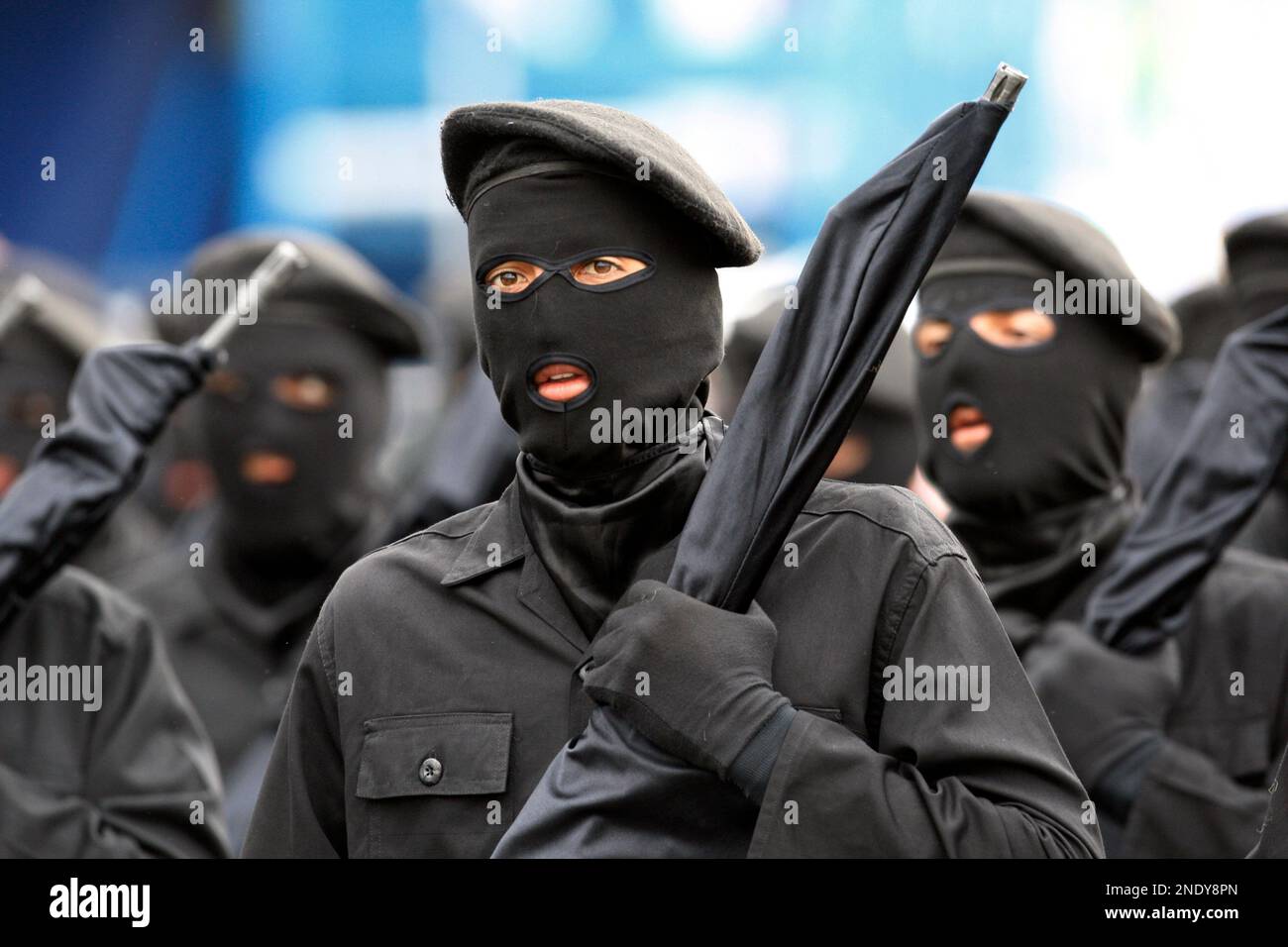Masked Iranian army members, march during a parade ceremony marking ...