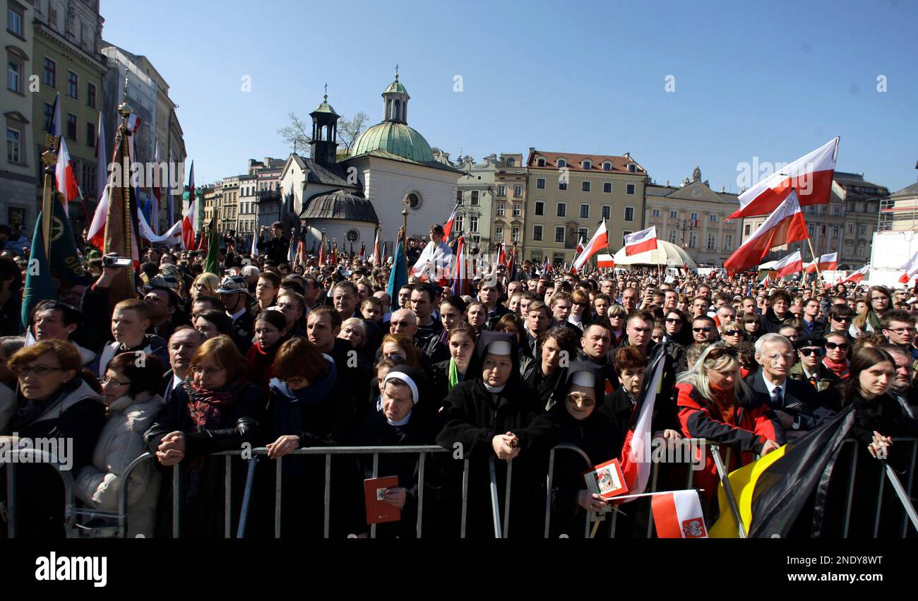 Mourners react as coffins with Late Polish President Lech Kaczynski and ...