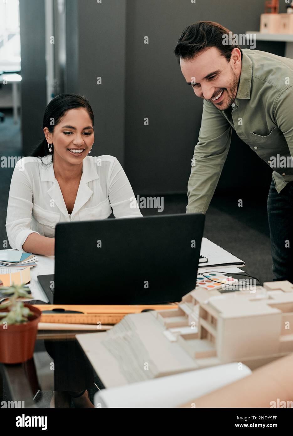 The client seems impressed with our work. two young architects working ...