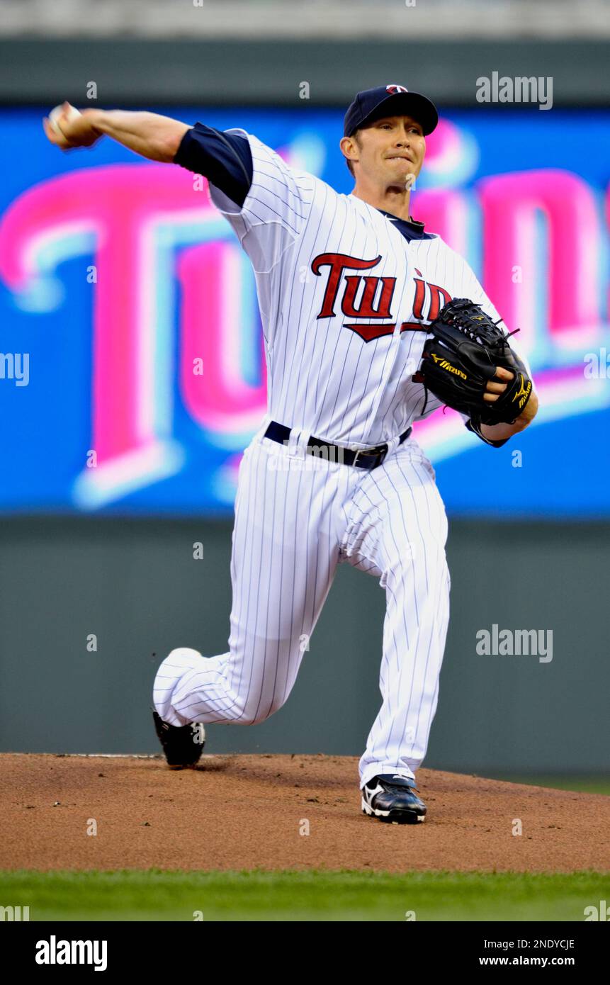 Minnesota Twins starting pitcher Scott Baker throws against the Kansas ...