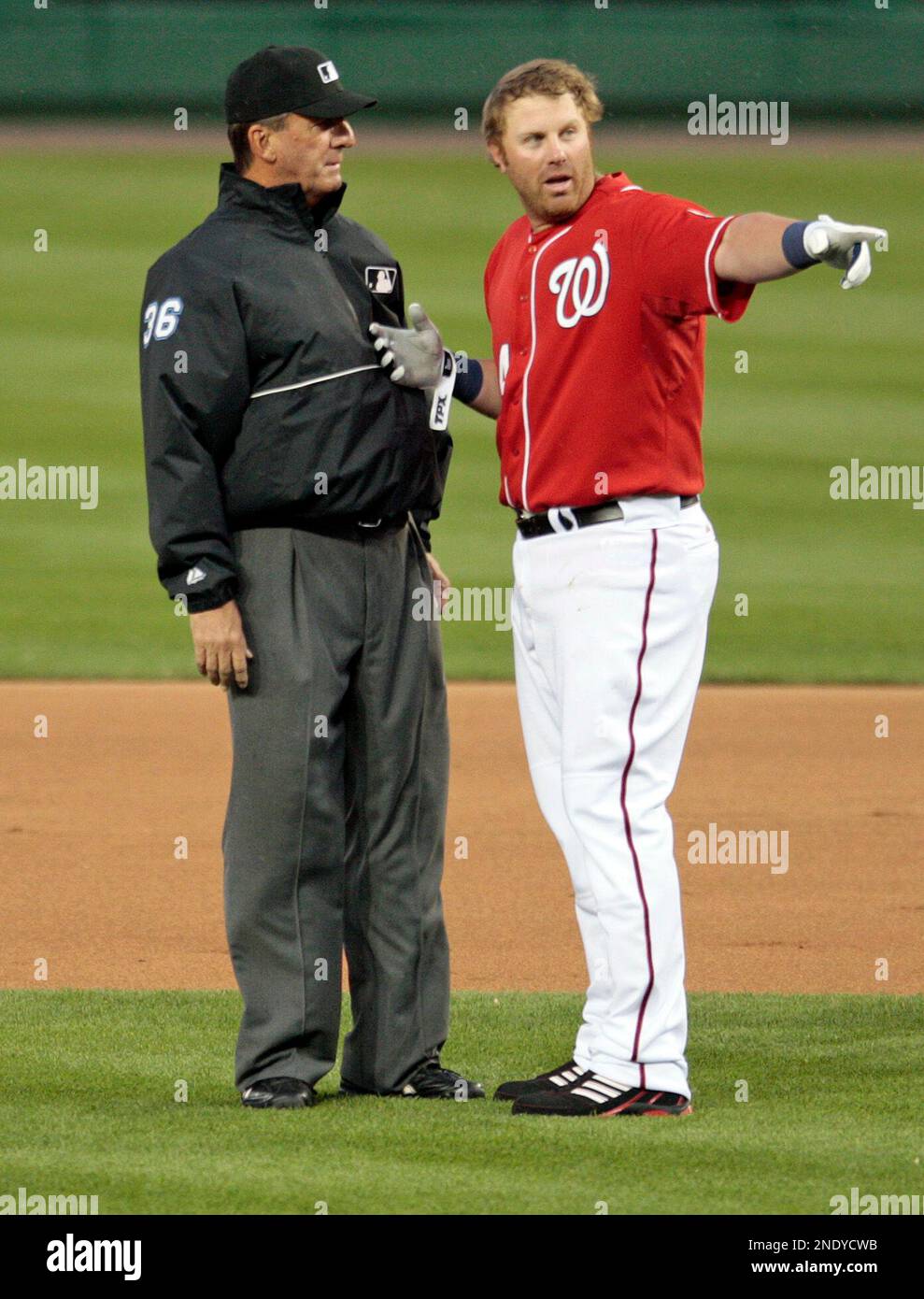 Washington Nationals' Adam Dunn, right, argues with first base umpire ...