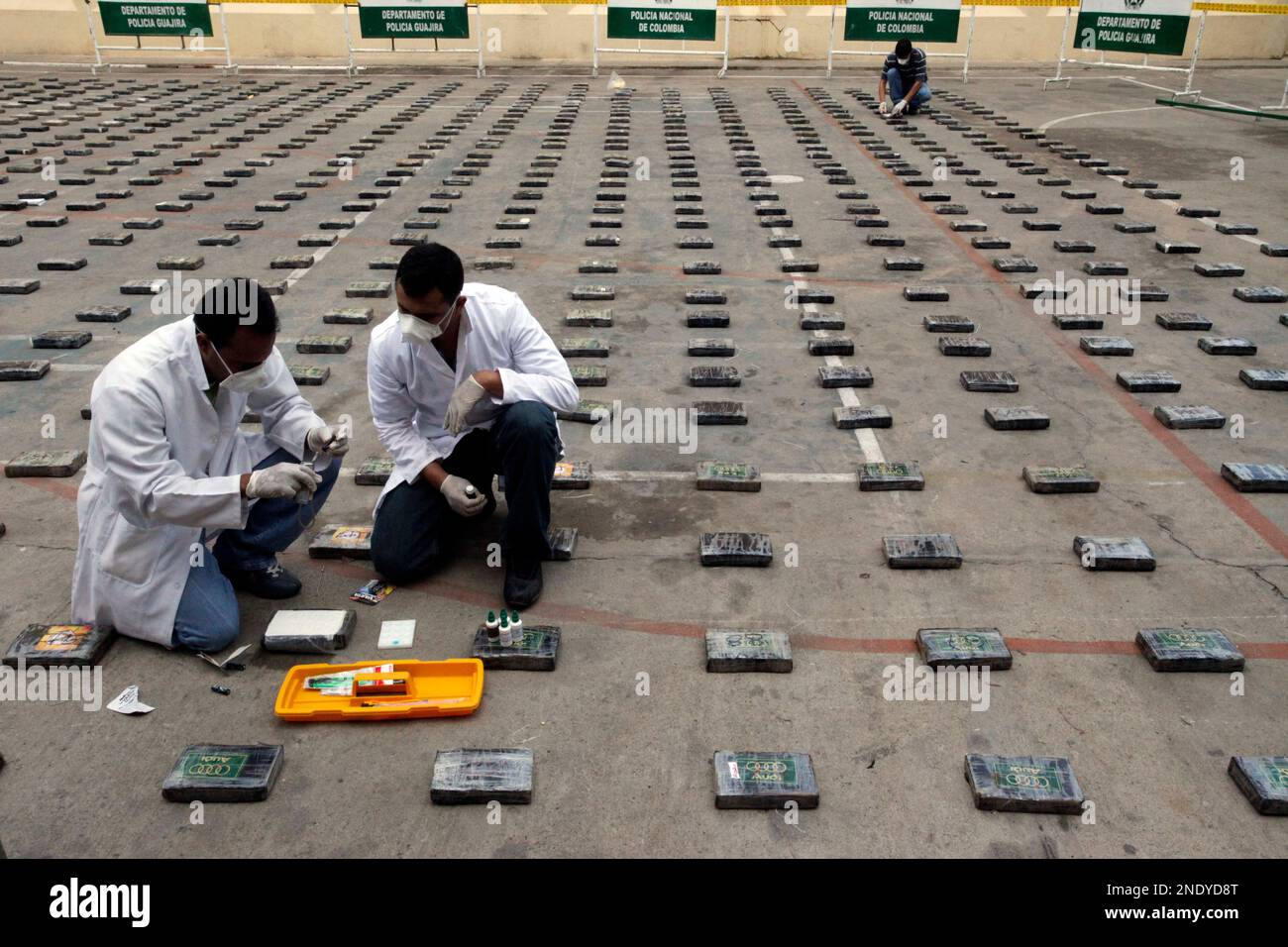 Police test seized cocaine on display for the press at a police station ...