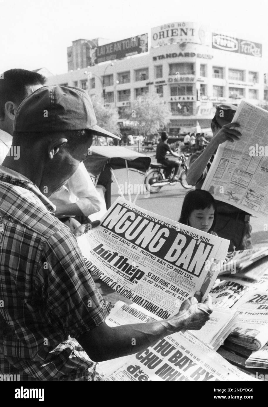 “Cease-fire” reads the headline of a newspaper just purchased by a ...